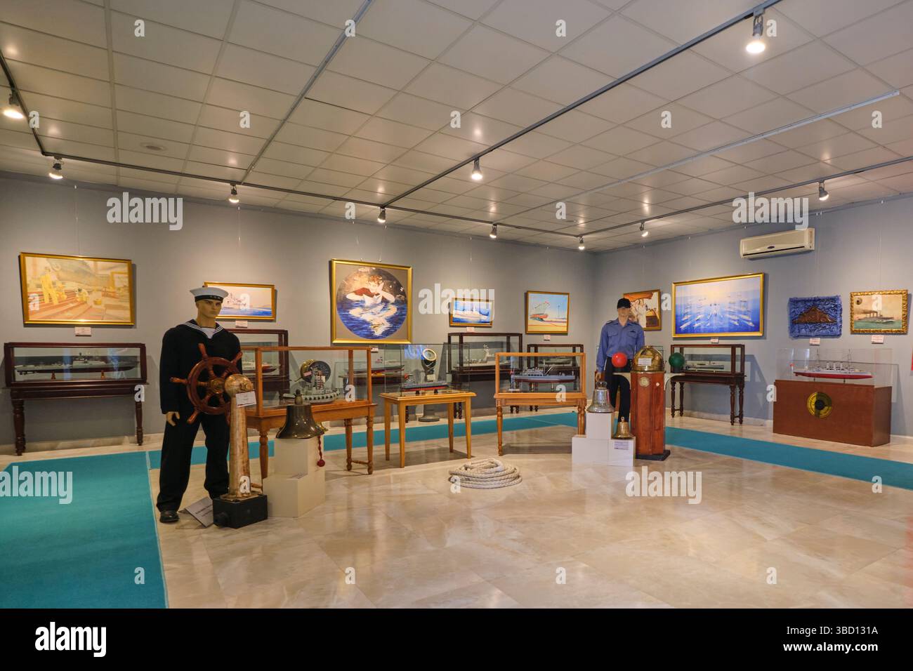 A display of typical Naval uniforms and various models of Navy ships ...