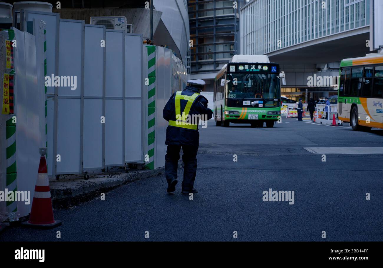 Security personnel paces through a bus terminal as “Out of Service ...