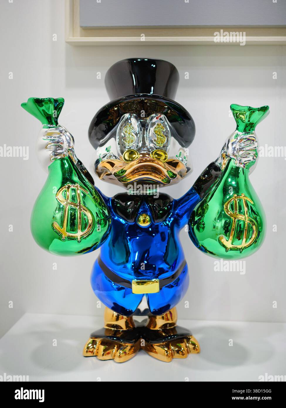 Displaying Wealth - Sculpted Duck Holds Shiny Green Money Bags Stock ...