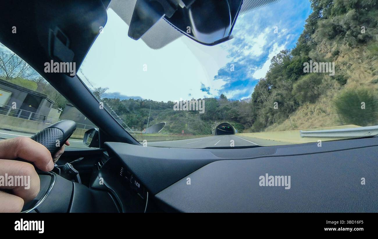 Driving a car in a highway with wide windshield and wide angle view ...