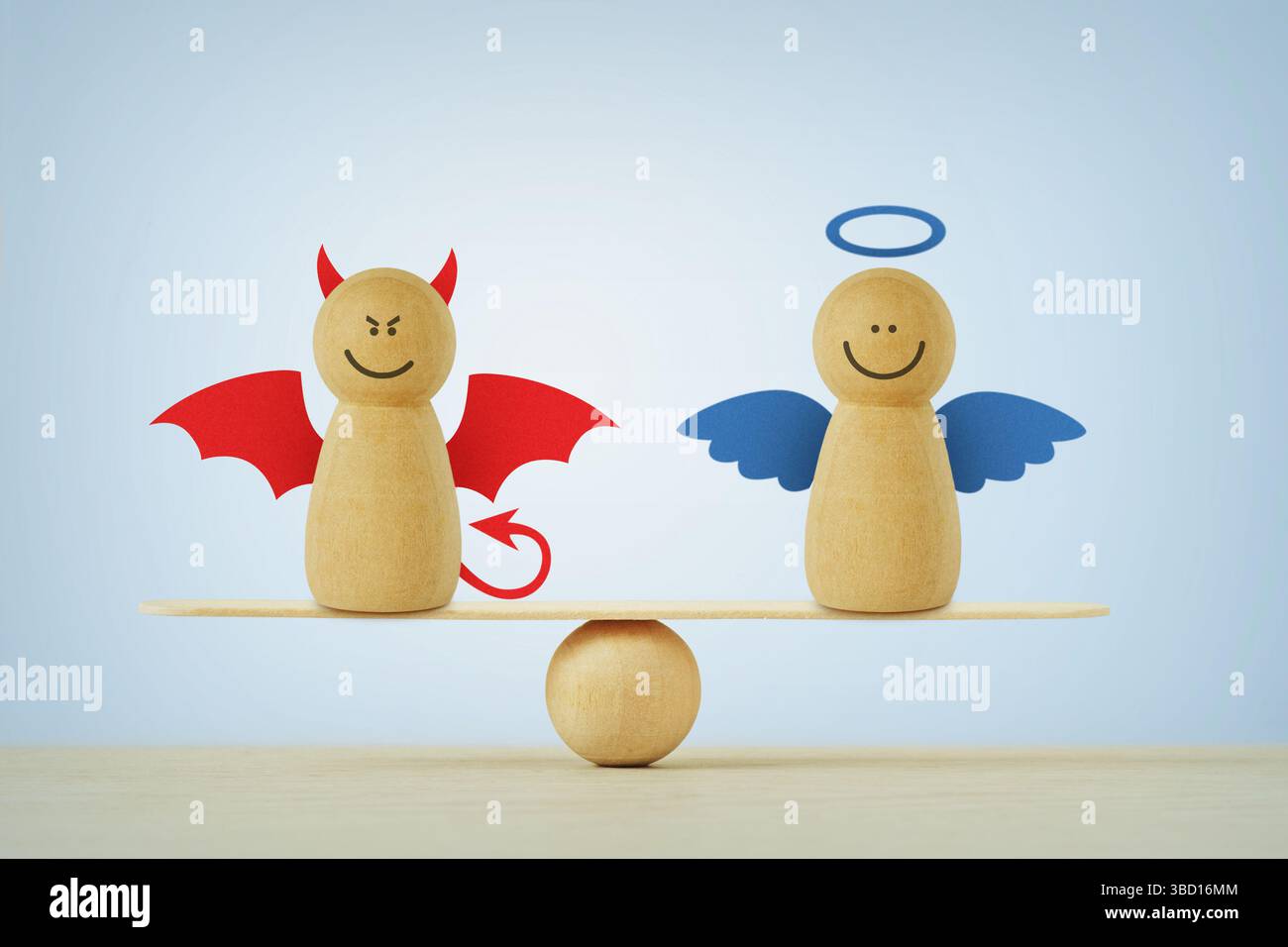 Devil and angel wooden pawn on balance scale - Balance between good and ...