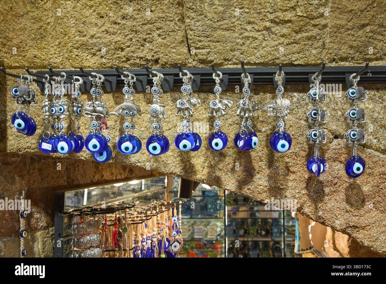 A collection of vibrant blue Turkish evil eye charms Nazar amulets are ...