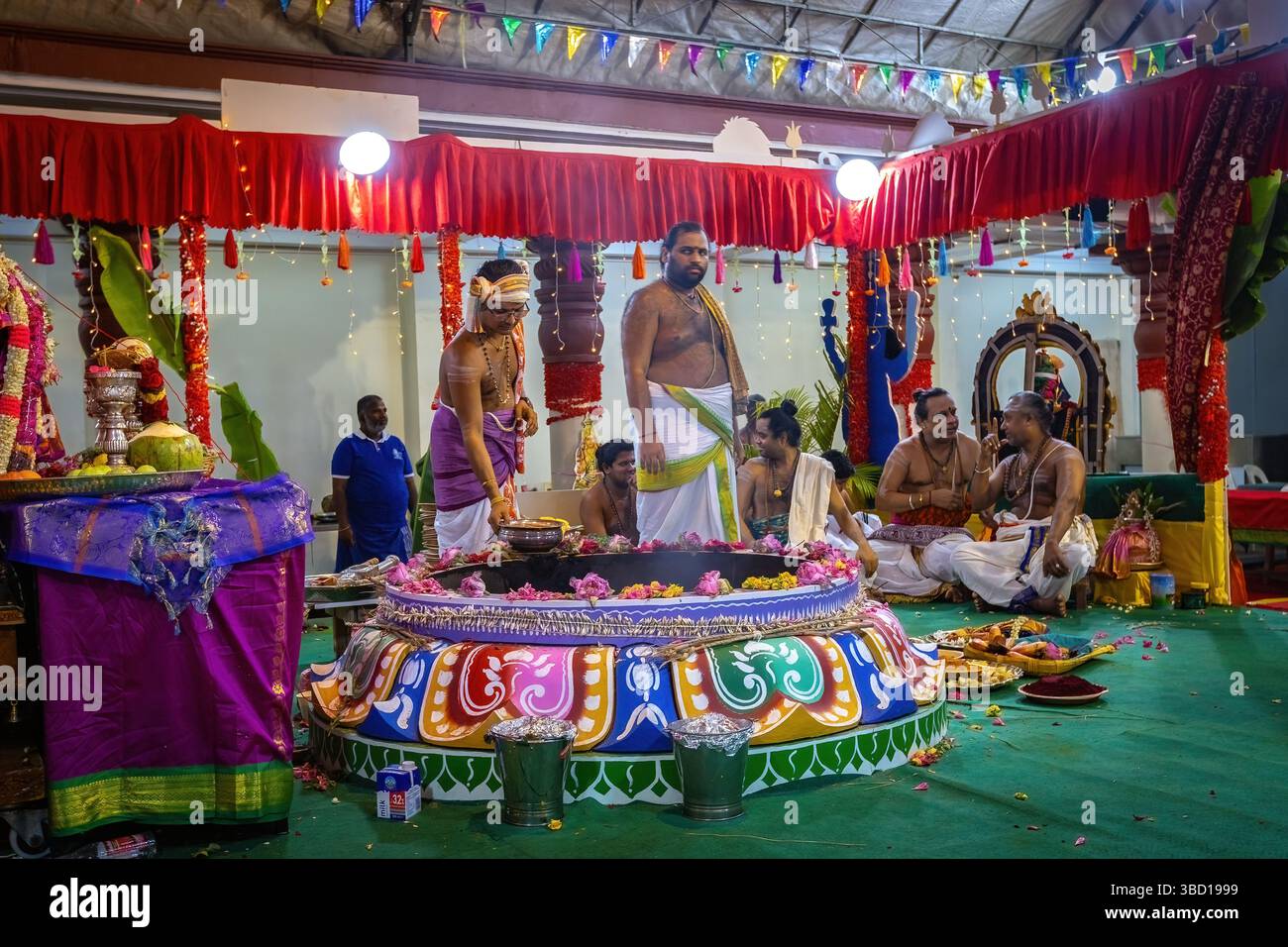 Hindu brahmins performing Puja in the Sri Mariamman Temple in Singapore ...