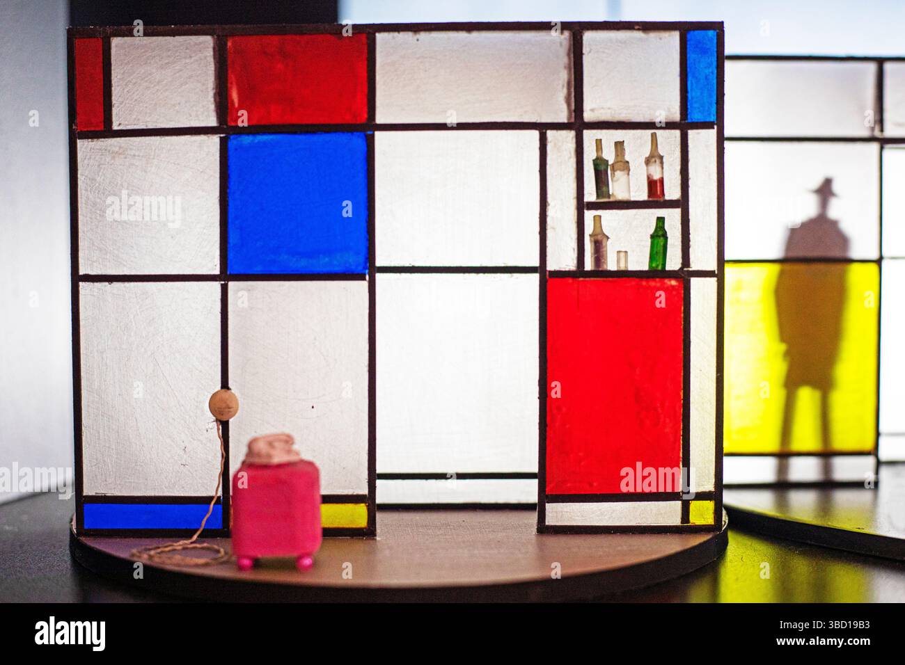 stylish interior with stained glass partitions and silhouette of a ...