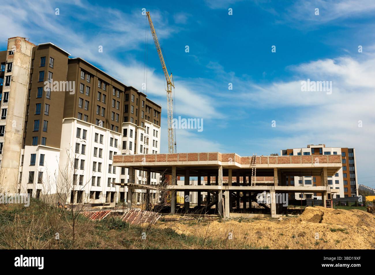 Construction site with a tower crane and unfinished concrete structure ...