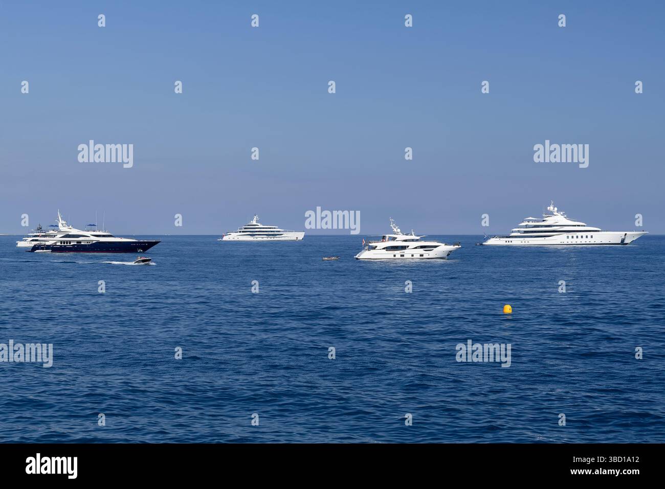 Monte Carlo, Monaco - View on luxury yachts at anchor off the coast of ...