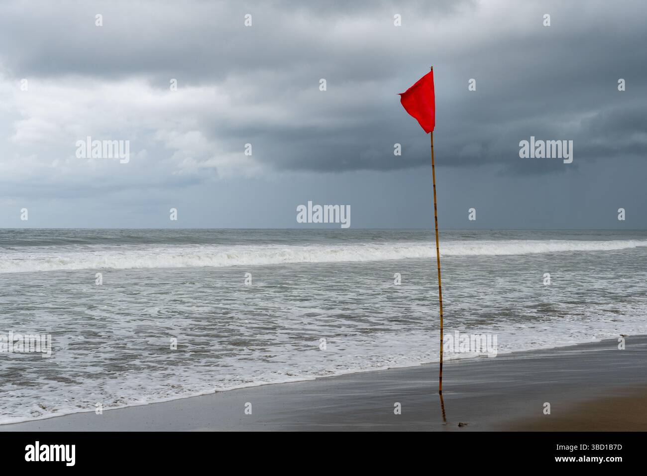 Bali, Indonesia - December 11, 2024: Red flag on a beach. The flag is ...