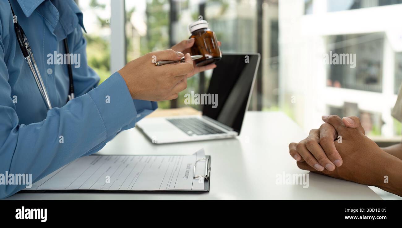 Health and Wellness: Doctor Reviewing Medication with Patient Stock ...