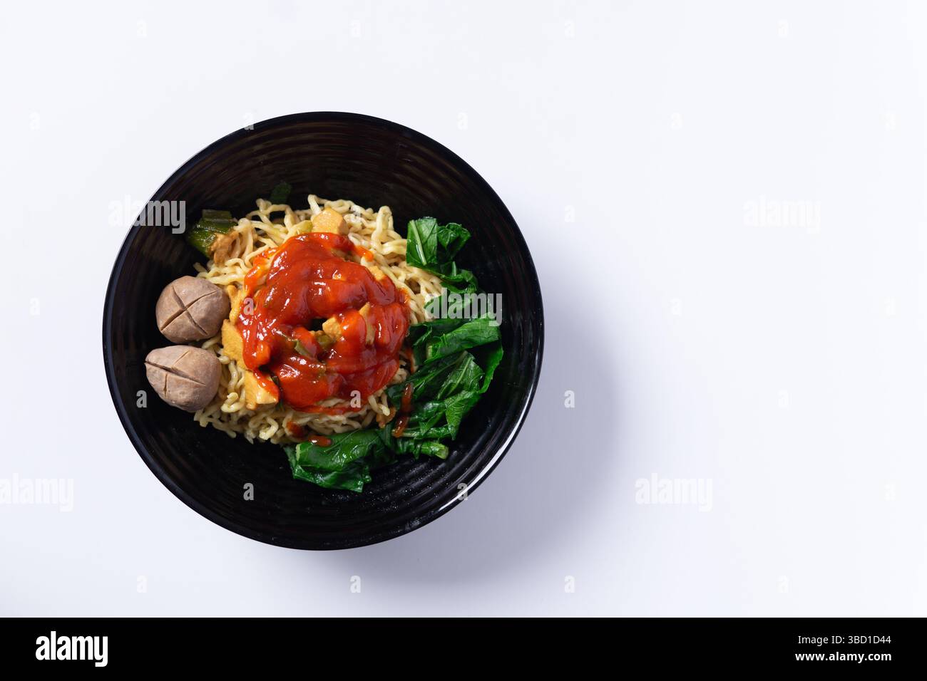 Top view of delicious mie ayam with meatball and vegetable served on ...