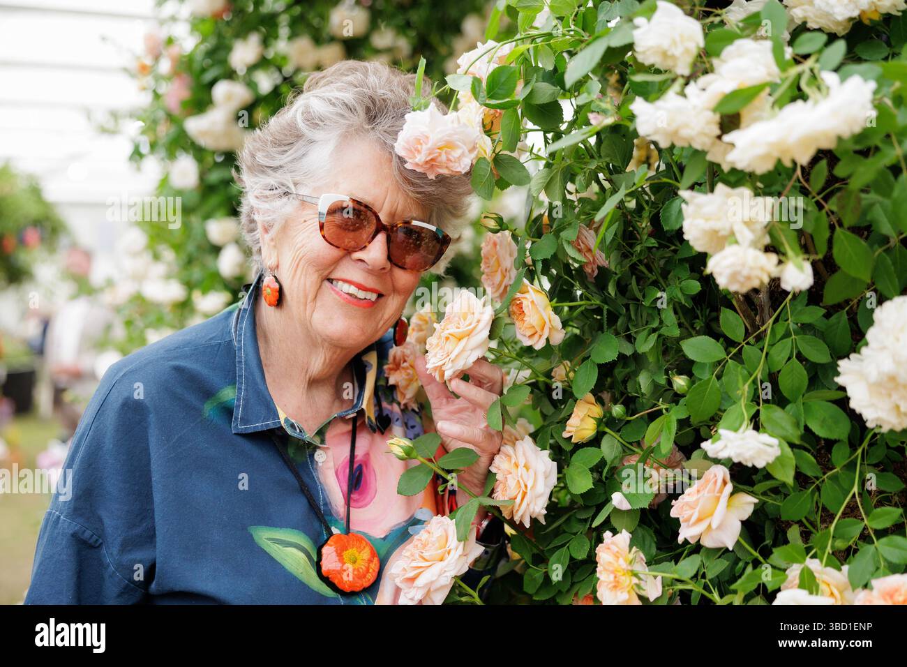Pru Leith, Great British Bake Off presenter smelling roses on the Peter ...
