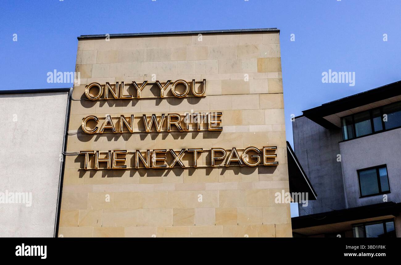 "Only You Can Write the Next Page" a sign on side of Clayport Library ...