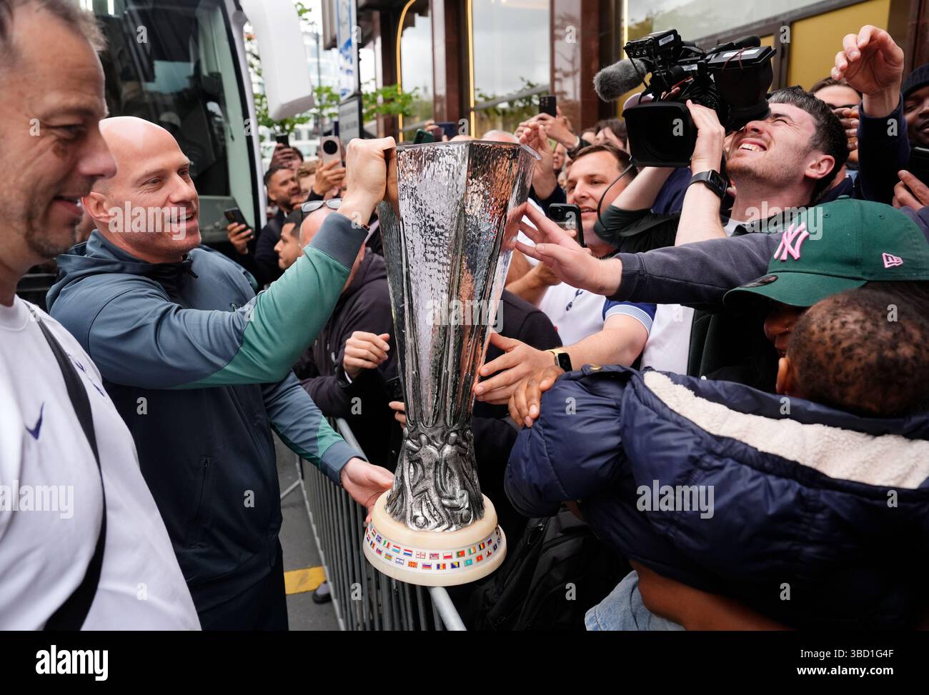 The trophy is brought out by liaison officer Allan Dixon to fans as the ...
