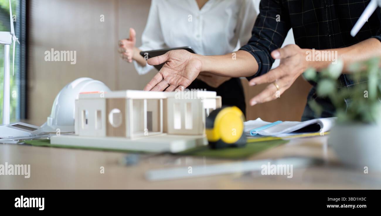 Sustainability and Engineering. Engineers collaborating on sustainable ...