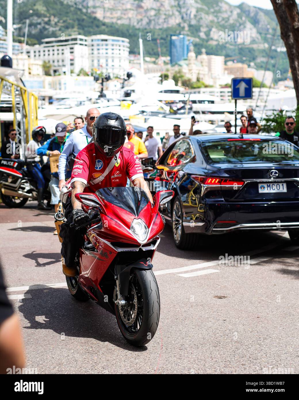 HAMILTON Lewis (gbr), Scuderia Ferrari SF-25, riding his motorbike MV ...