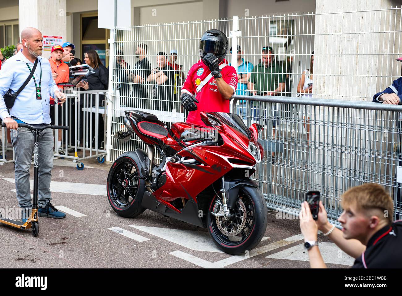 HAMILTON Lewis (gbr), Scuderia Ferrari SF-25, riding his motorbike MV ...