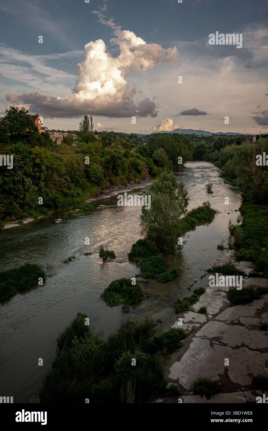 The Ter River flows abundantly crossing Roda de Ter village as ...