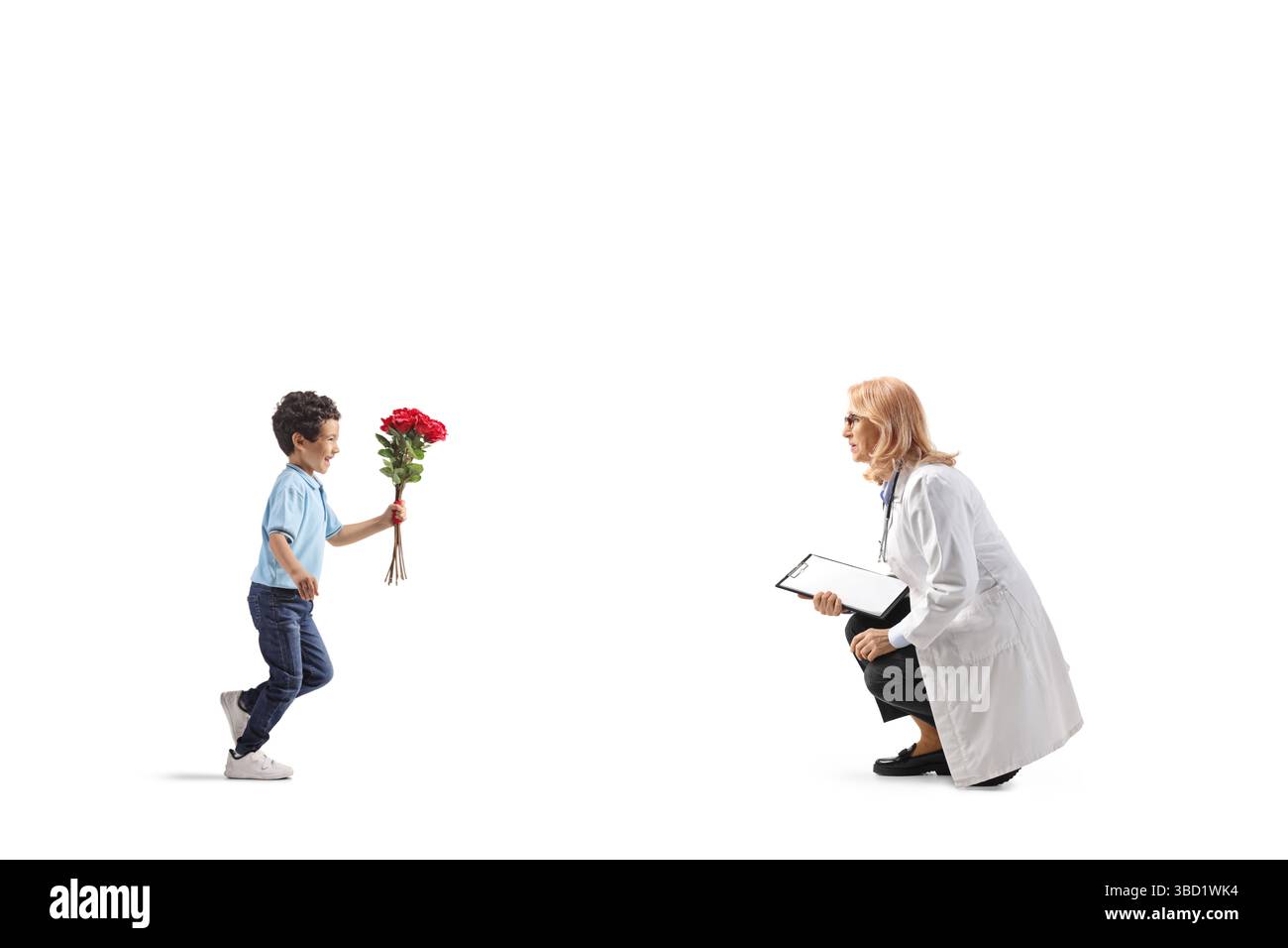 Full length profile shot of a boy bringing flowers to a female doctor ...