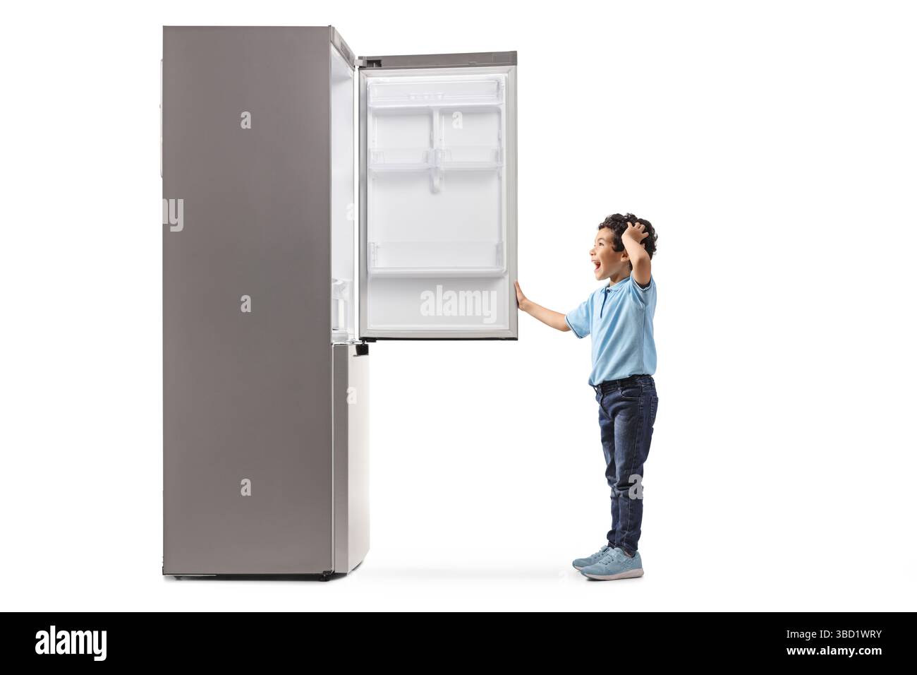 Full length profile shot of a surprised kid opening an empty fridge ...