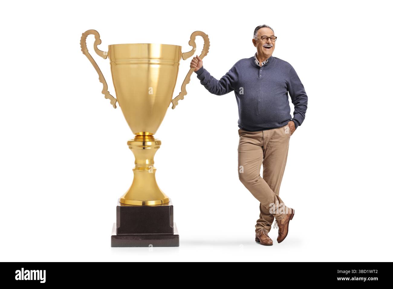Mature man with a big gold trophy cup isolated on white background ...