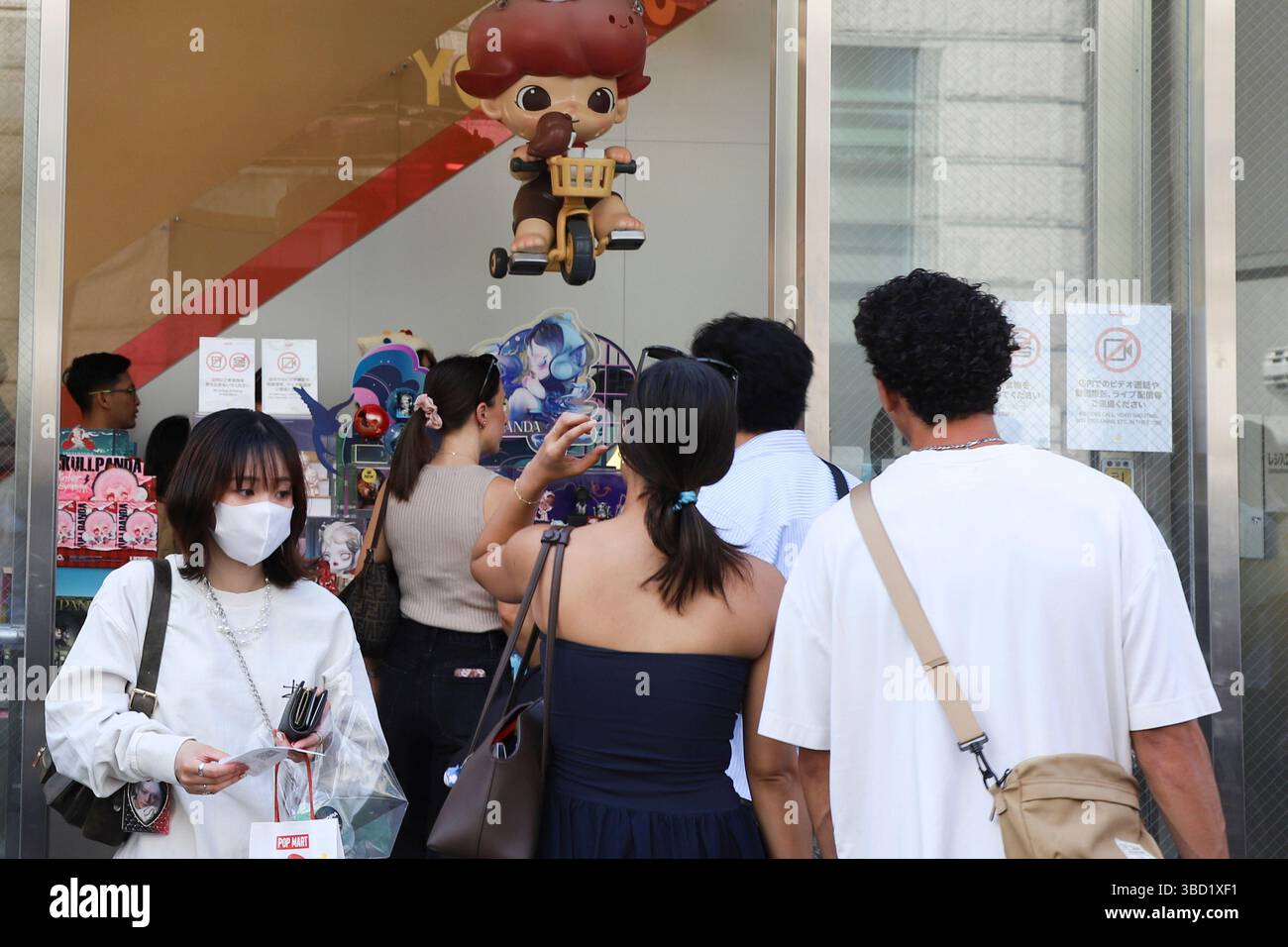 Tokyo, Japan. 21st May, 2025. Customers enter a POP MART store in Tokyo ...