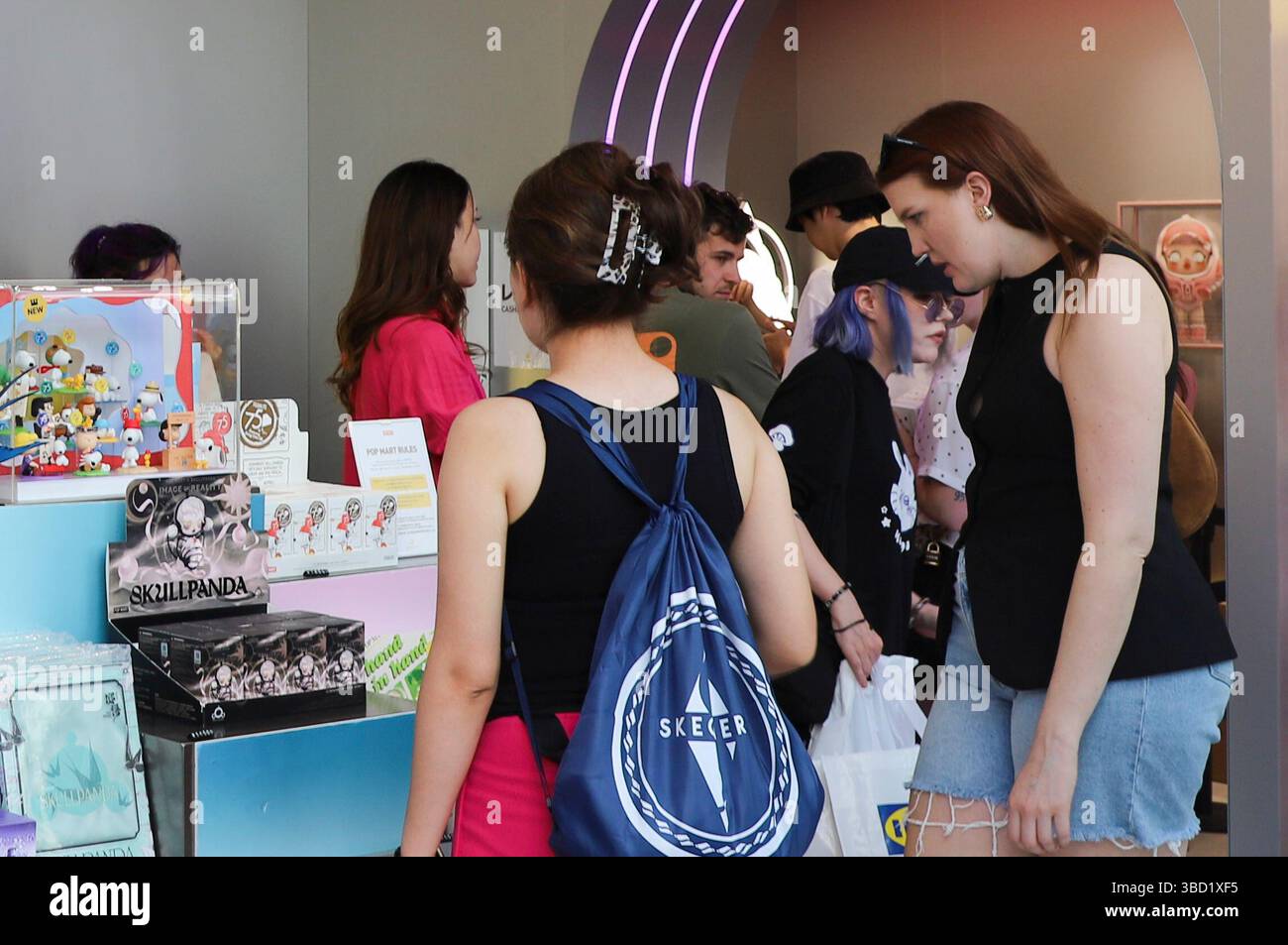Tokyo, Japan. 21st May, 2025. Customers purchase products at a POP MART ...