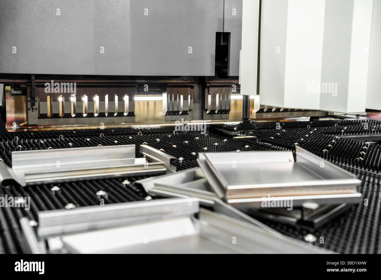 Automatic metal sheet bending machine at work in factory. CNC Panel ...