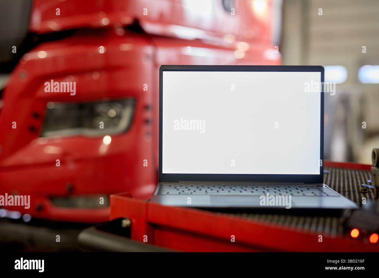 Displaying Open Laptop in Garage Workshop Setting Stock Photo - Alamy