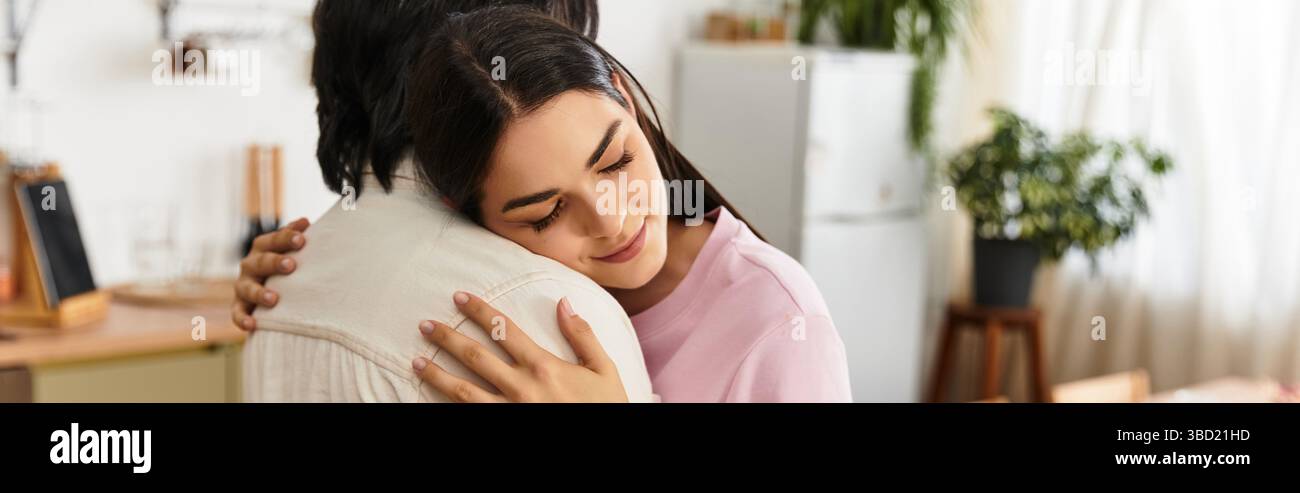 Couple shares a heartfelt hug at home, surrounded by warmth and ...