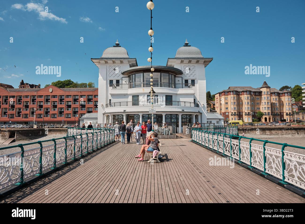 People on Penarth Pier in South Wales with a view of the white Art Deco ...