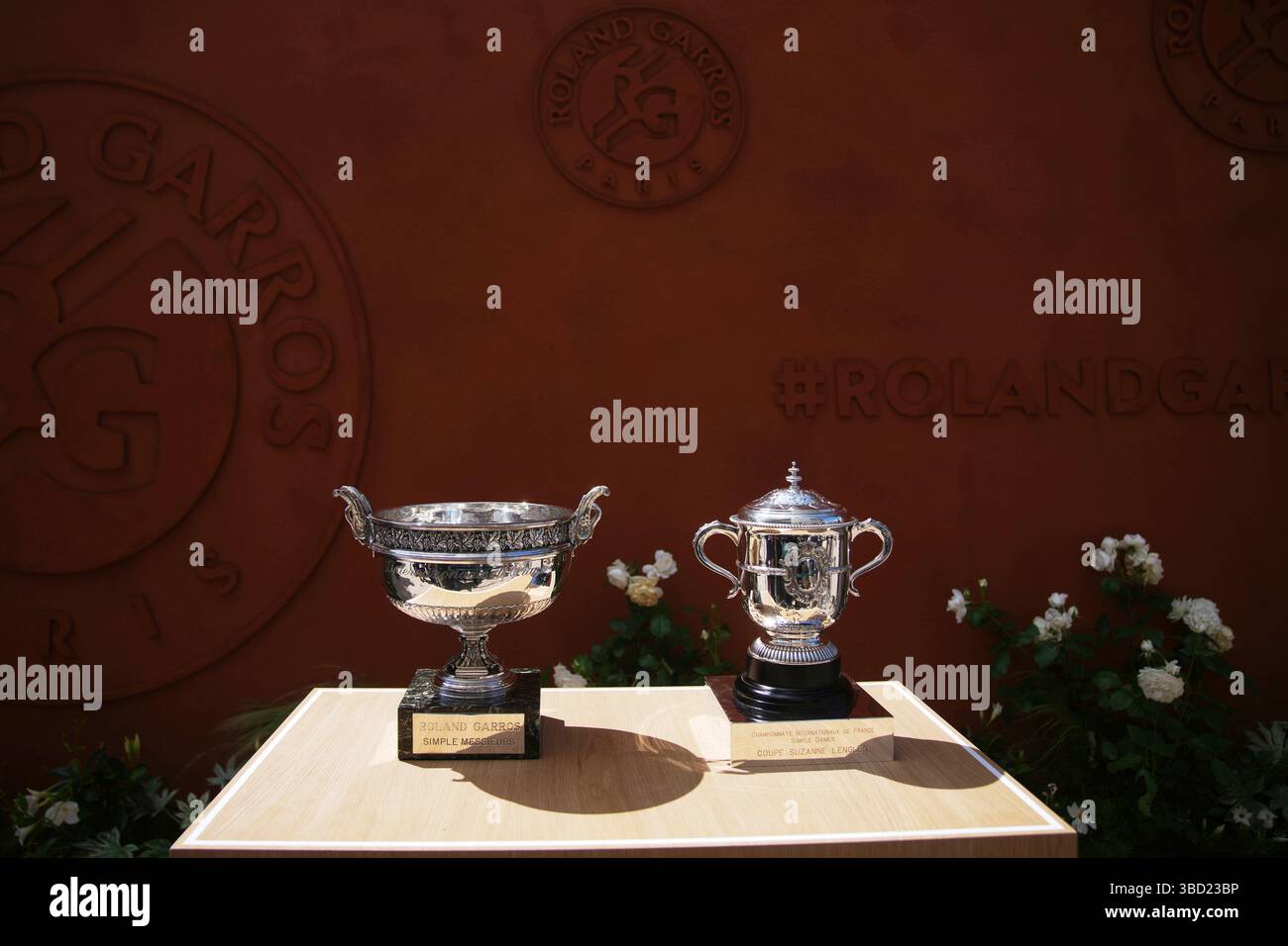 The men's, left, and women's trophies are displayed before the draw of ...