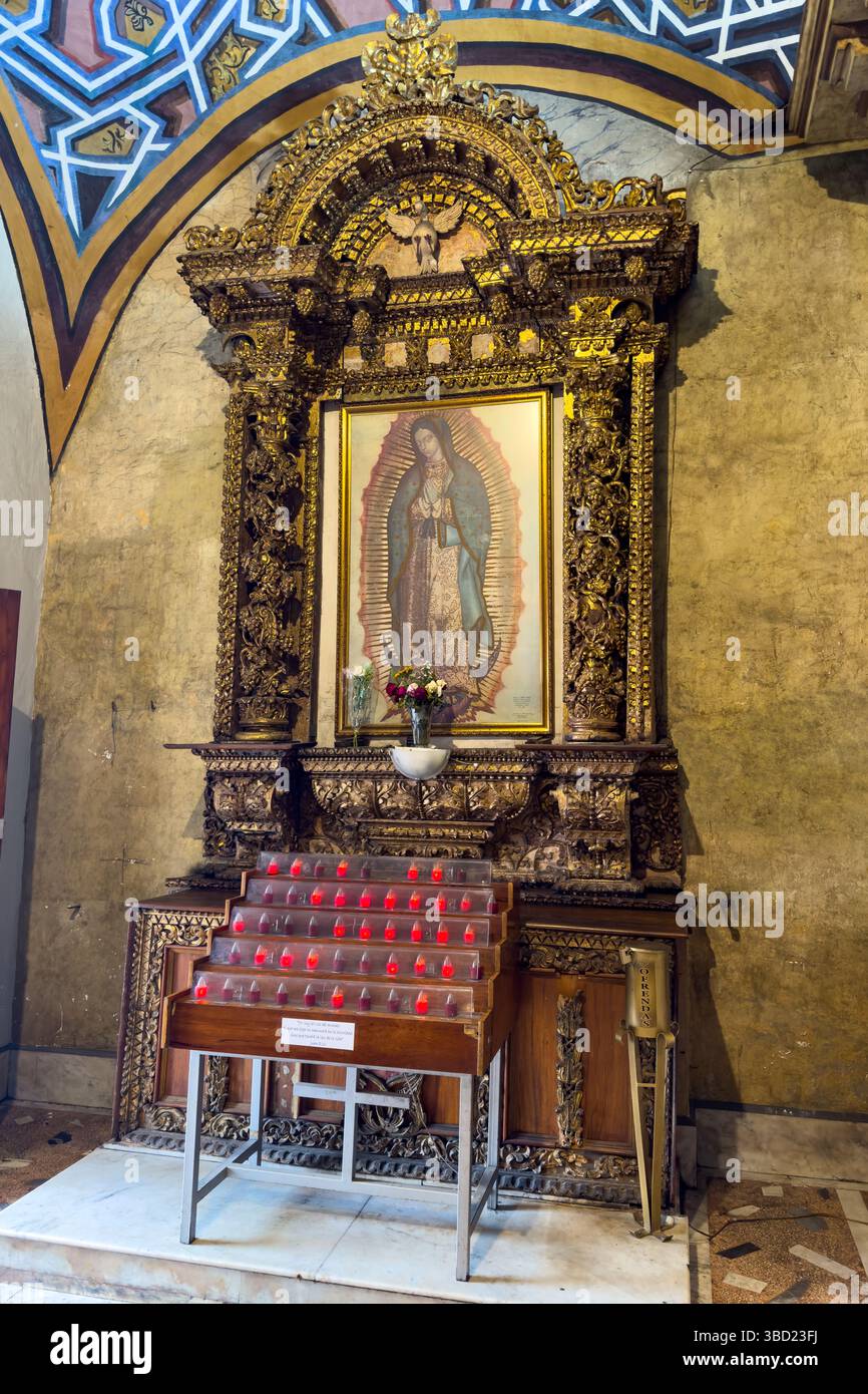 A painting of the Virgin Mary in an altarpiece of the Church of Santo ...