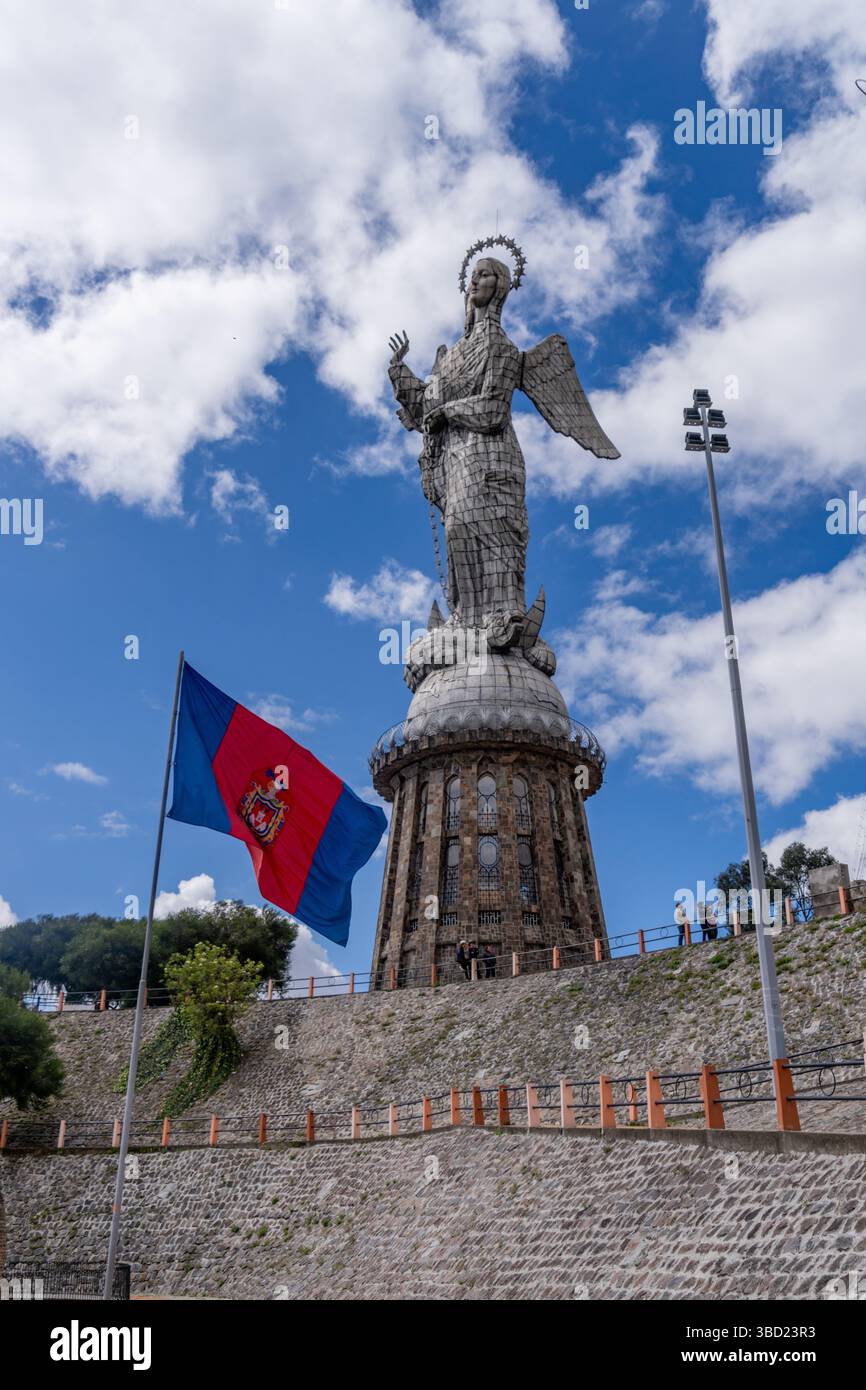 The Virgin of Panecillo or Virgin of Quito, with the flag of Quito on ...