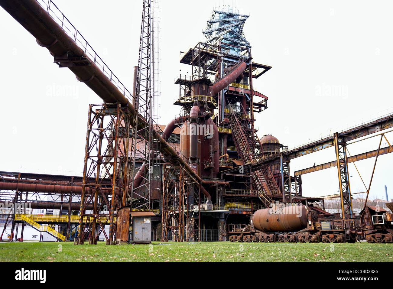 Industrial blast furnace and rusted railway tank at abandoned ...