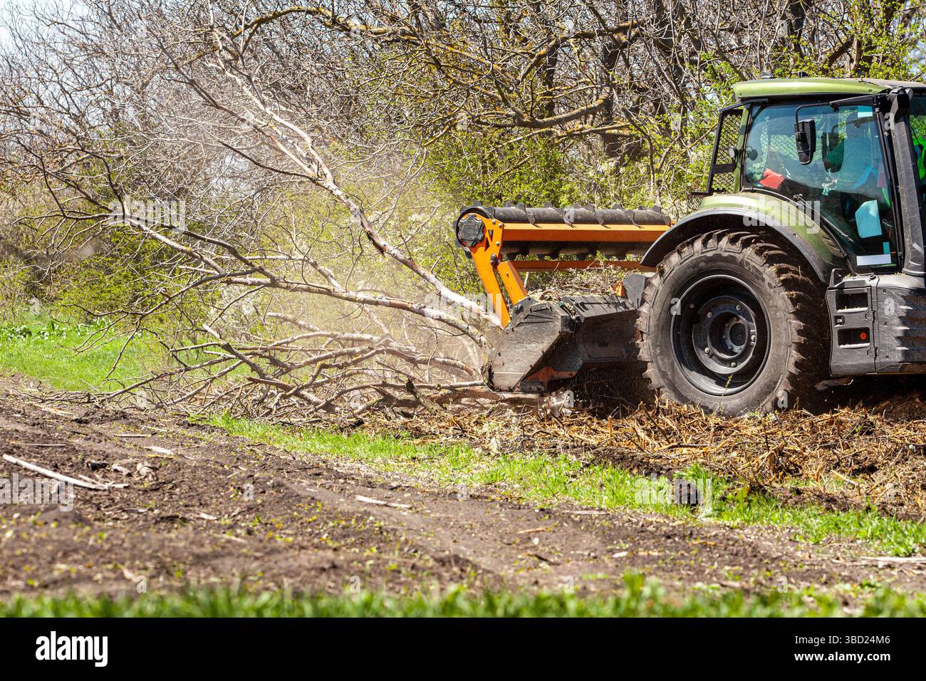 Picture of a tractor specialized in forest clearing that is in the ...