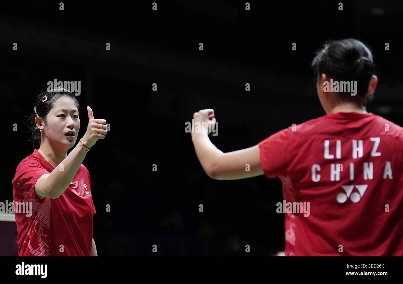 (250522) -- KUALA LUMPUR, May 22, 2025 (Xinhua) -- Keng Shuliang (L)/Li Huazhou celebrate ...