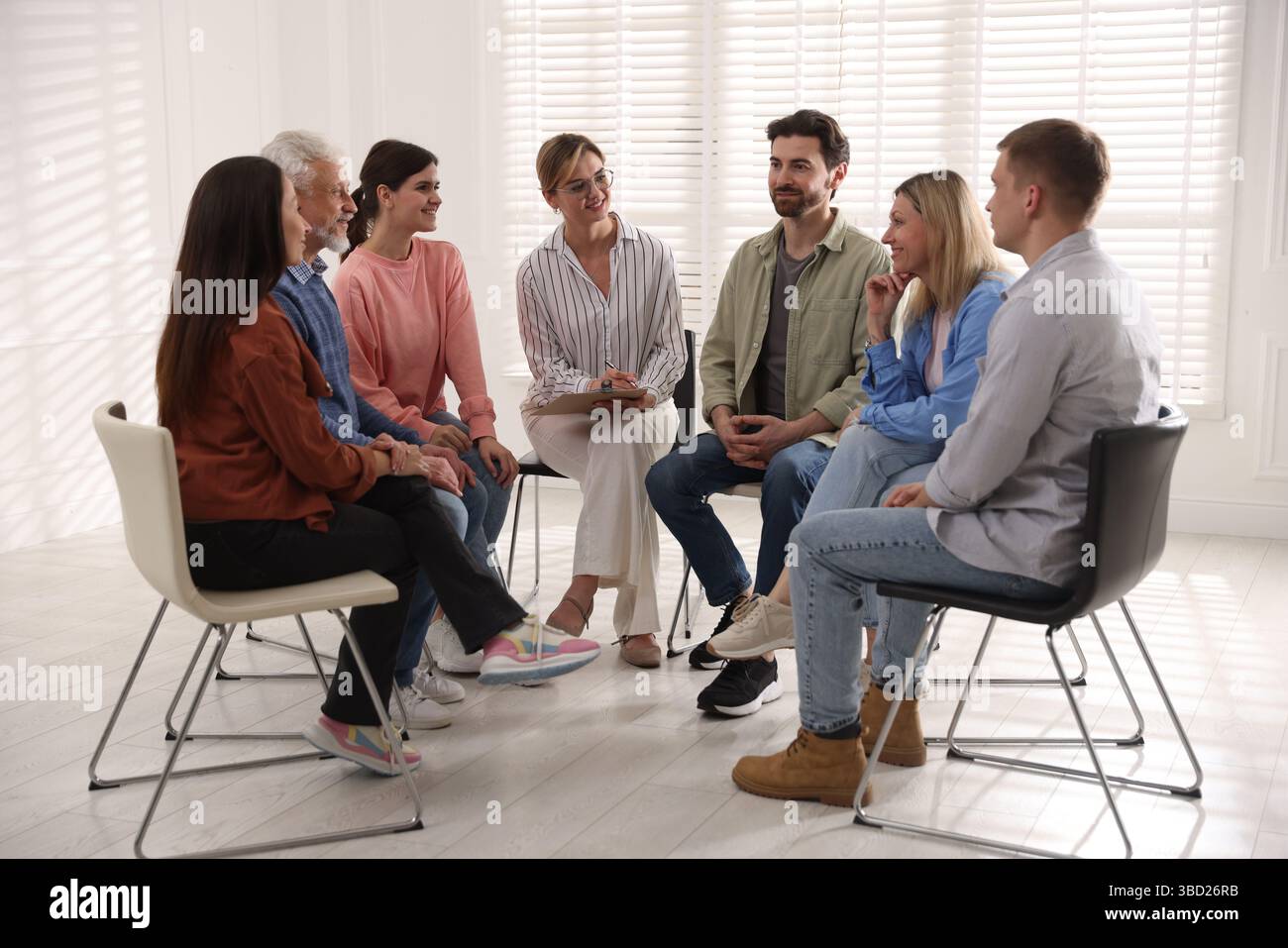Group of people having psychotherapy session indoors Stock Photo - Alamy