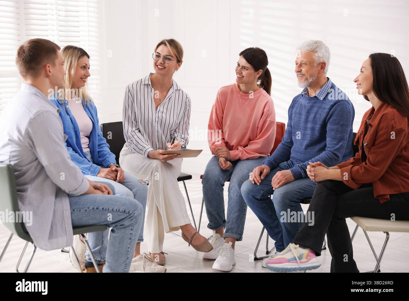 Group of people having psychotherapy session indoors Stock Photo - Alamy