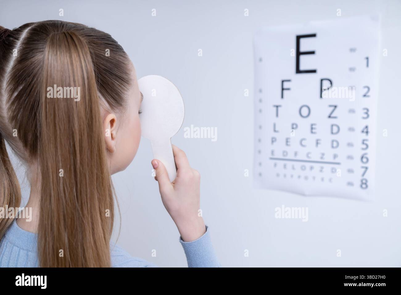 Close up of a caucasian girl having a Snellen vision test Stock Photo ...