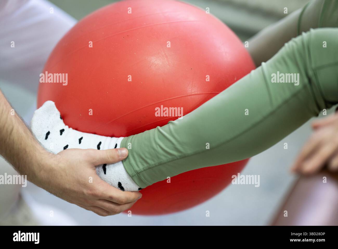 Leg Therapy Exercise with Ball Stock Photo - Alamy
