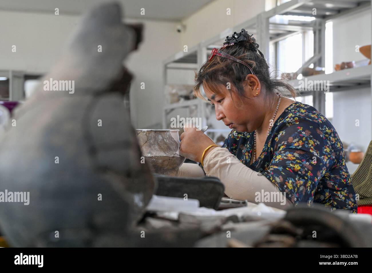 Tai'an, China's Shandong Province. 20th May, 2025. A staff member ...