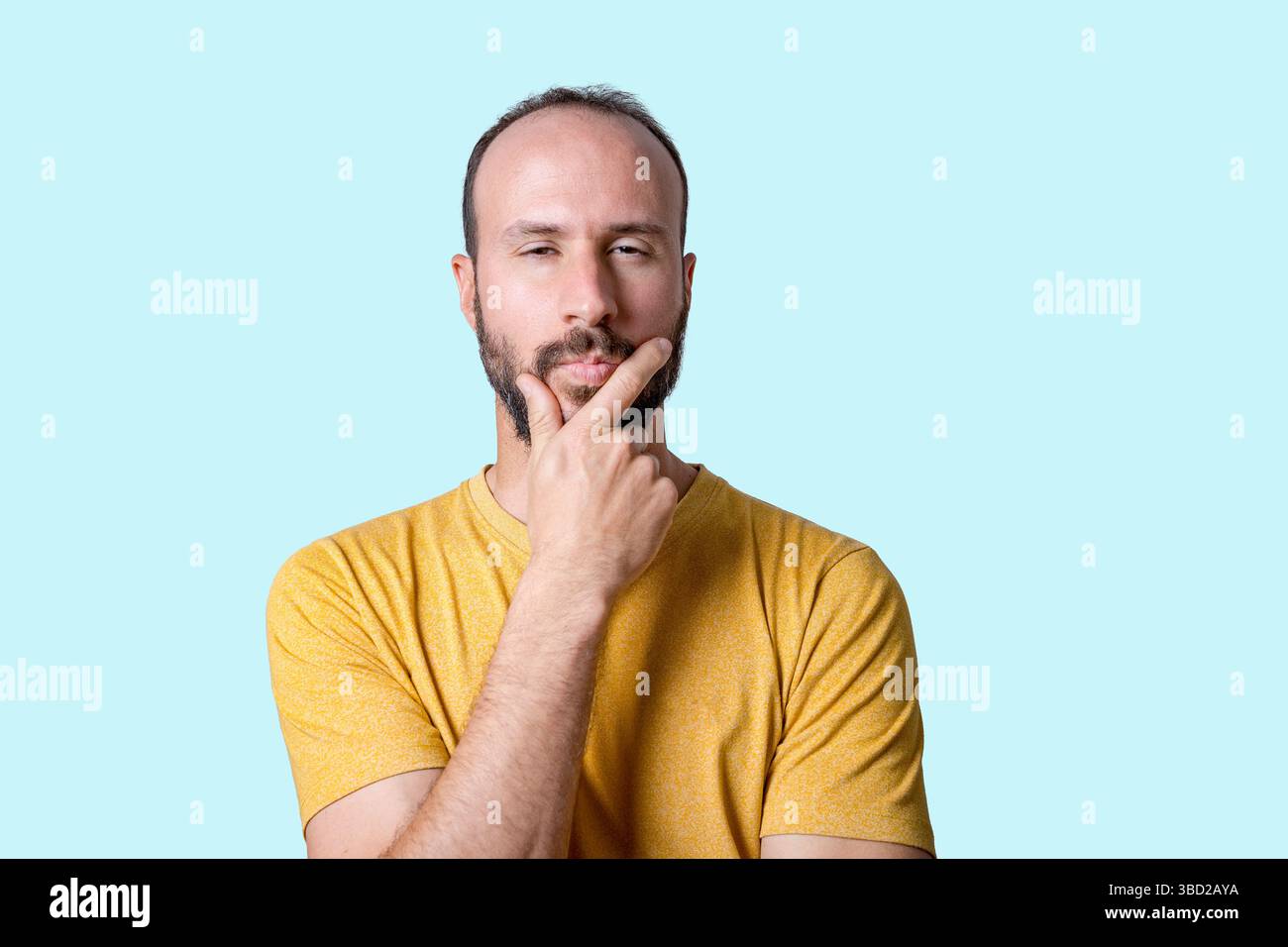 portrait of young man confused an uncertain, shrugging with open hands ...