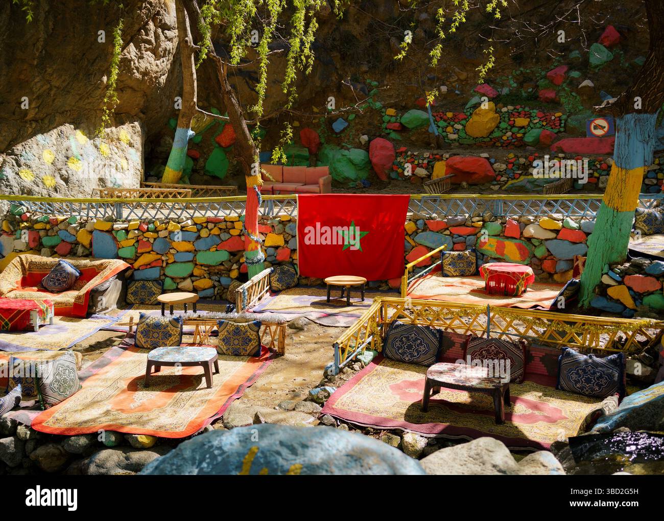 Colorful Outdoor Café with Carpets, Pillows, and Low Tables Along the ...