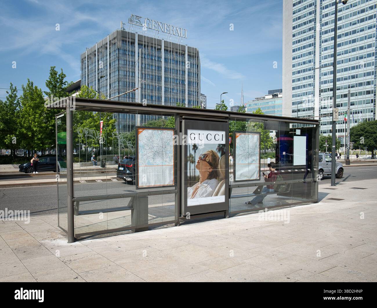 Milano Italy, a bus stop with Gucci advertising billboard in front of ...