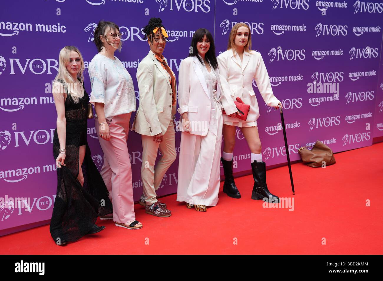 Eve Horne (centre), Anna Phoebe (second right), Imogen Williams (right) and guests attend the ...