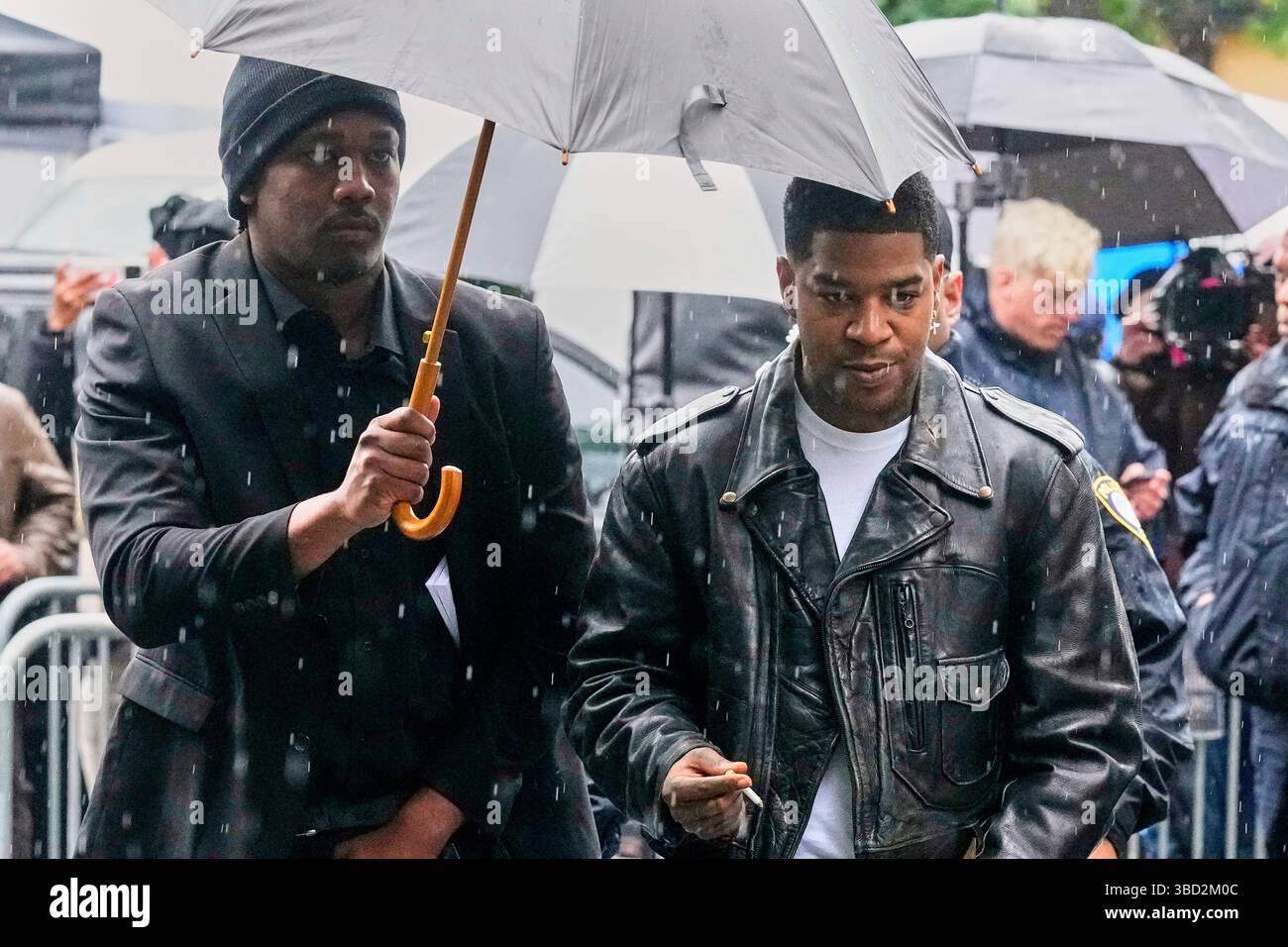 Rapper Kid Cudi, right, arrives at Federal Court for the trial of Sean ...
