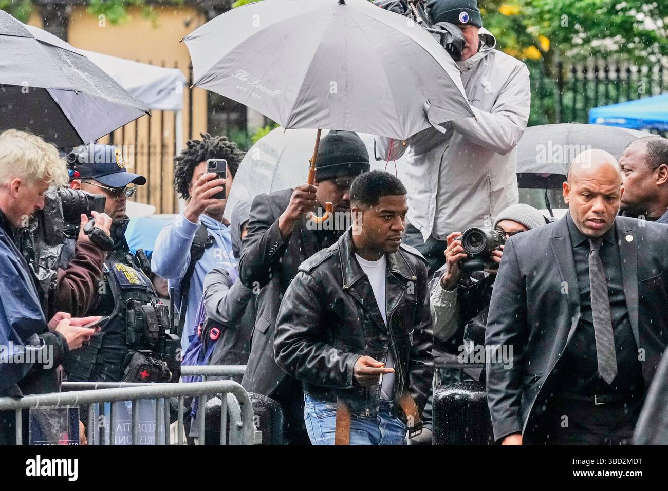 Rapper Kid Cudi, center, arrives at Federal Court for the trial of Sean ...