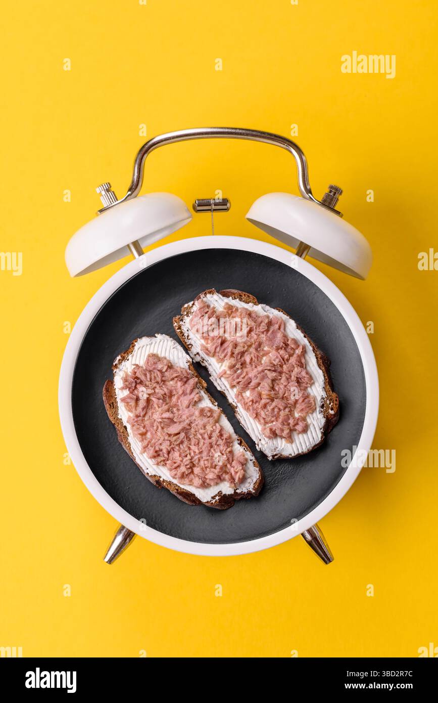 Breakfast sandwich with toast, tuna and avocado. Breakfast as a plate ...