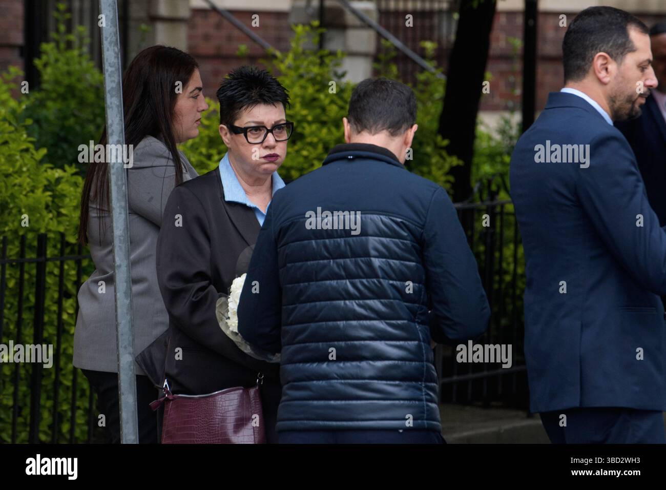 Neshi Sinvani, second from left, and Hadar Abu, left, staff with the ...