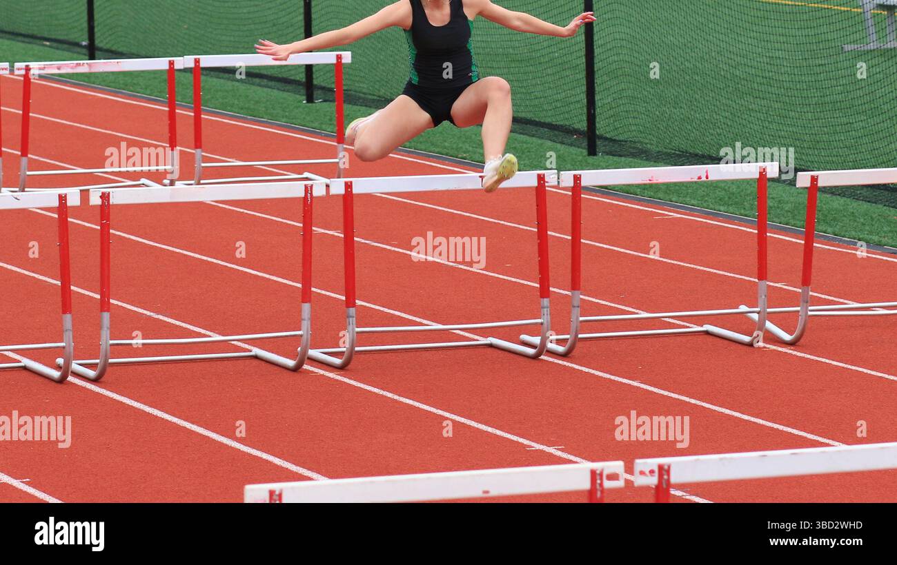 Female athlete jumps over hi-res stock photography and images - Alamy
