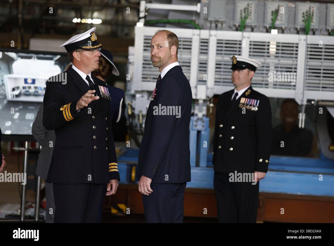 Britain's Prince William, centre, attends the naming ceremony for HMS ...